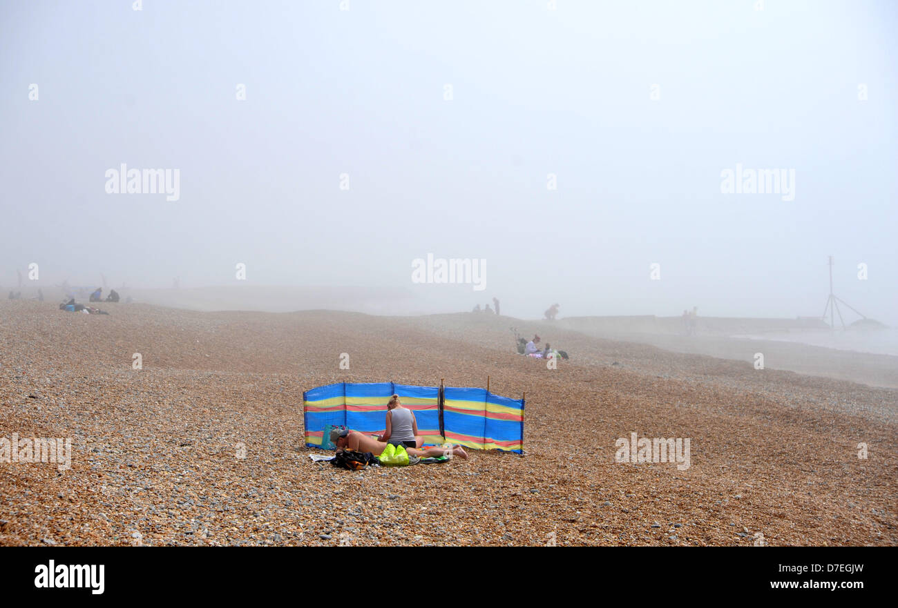 People behind windbreak at the beach hi-res stock photography and ...