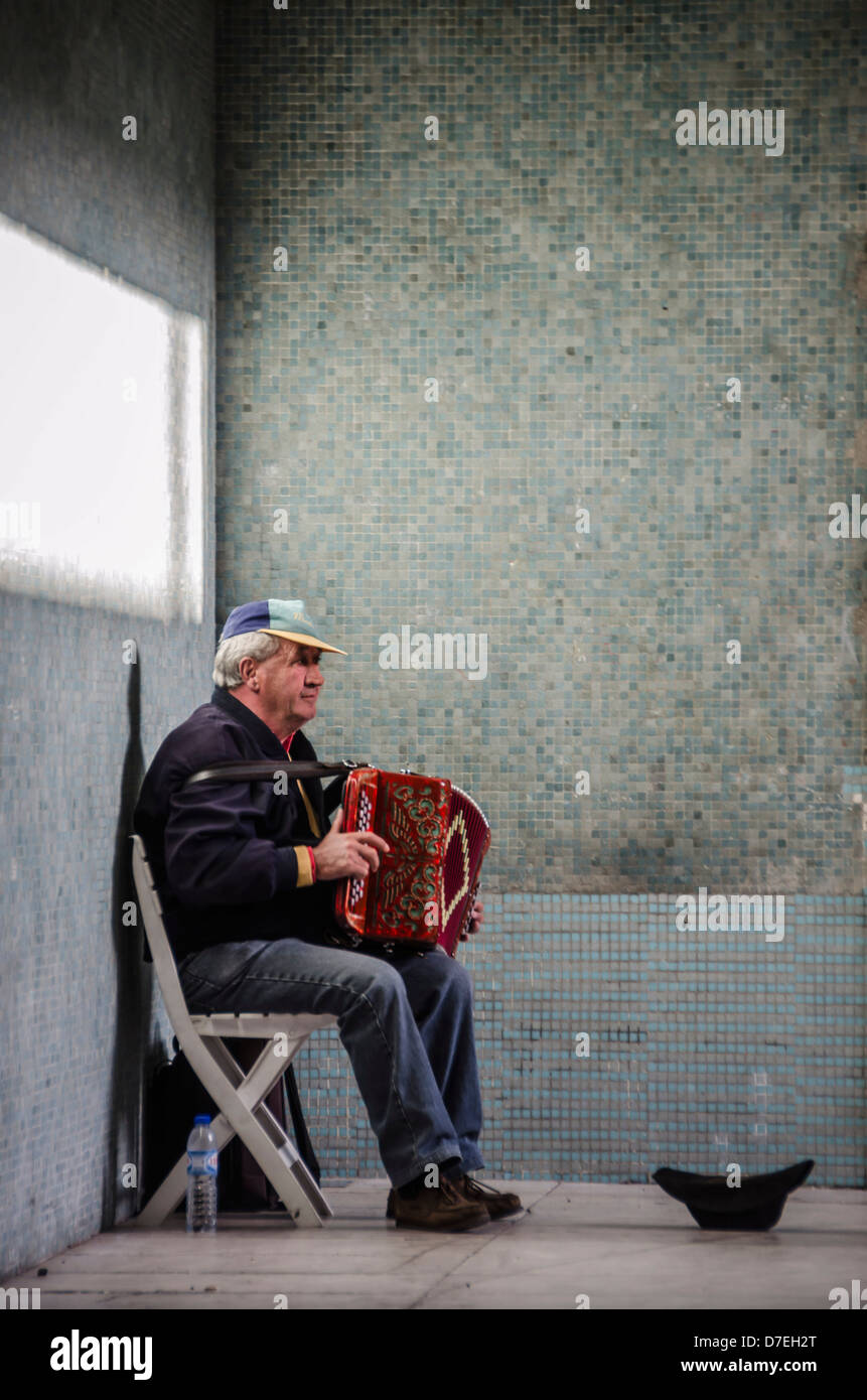 lonely musician facing the entrance Stock Photo - Alamy
