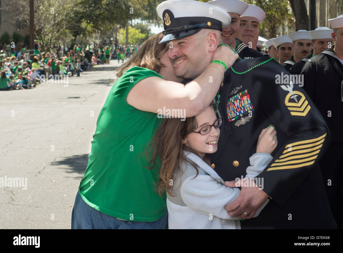 A Sailor hugs his family at a parade Stock Photo - Alamy