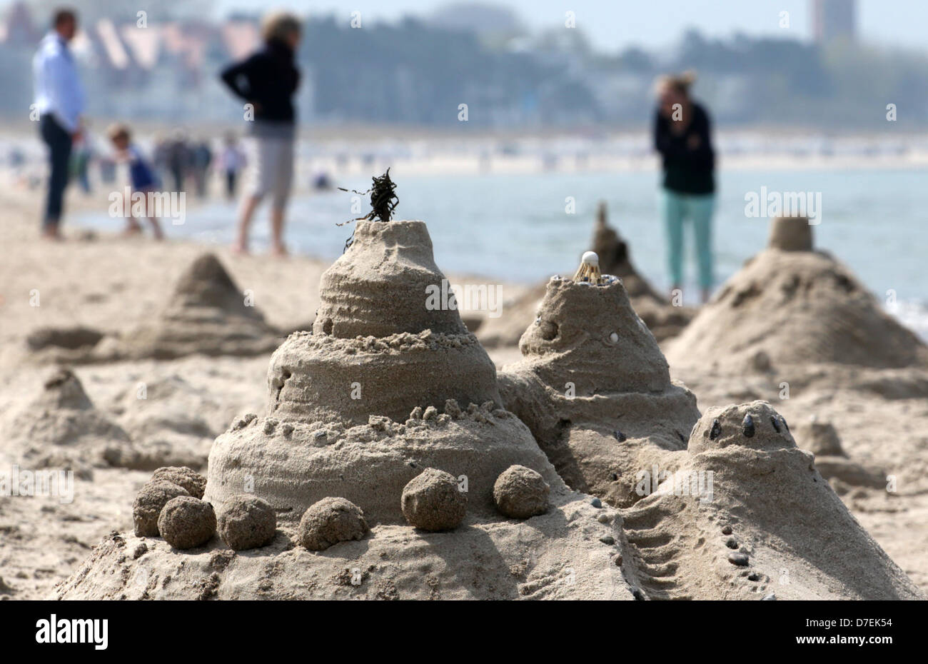First sand castles stand on a beach at Ostseebad Warnemuende in Germany ...