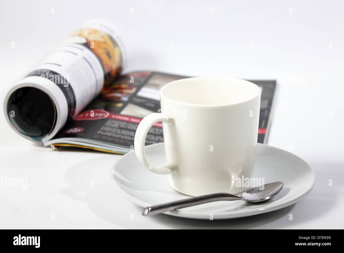 A Coffee and magazine on a white Stock Photo - Alamy