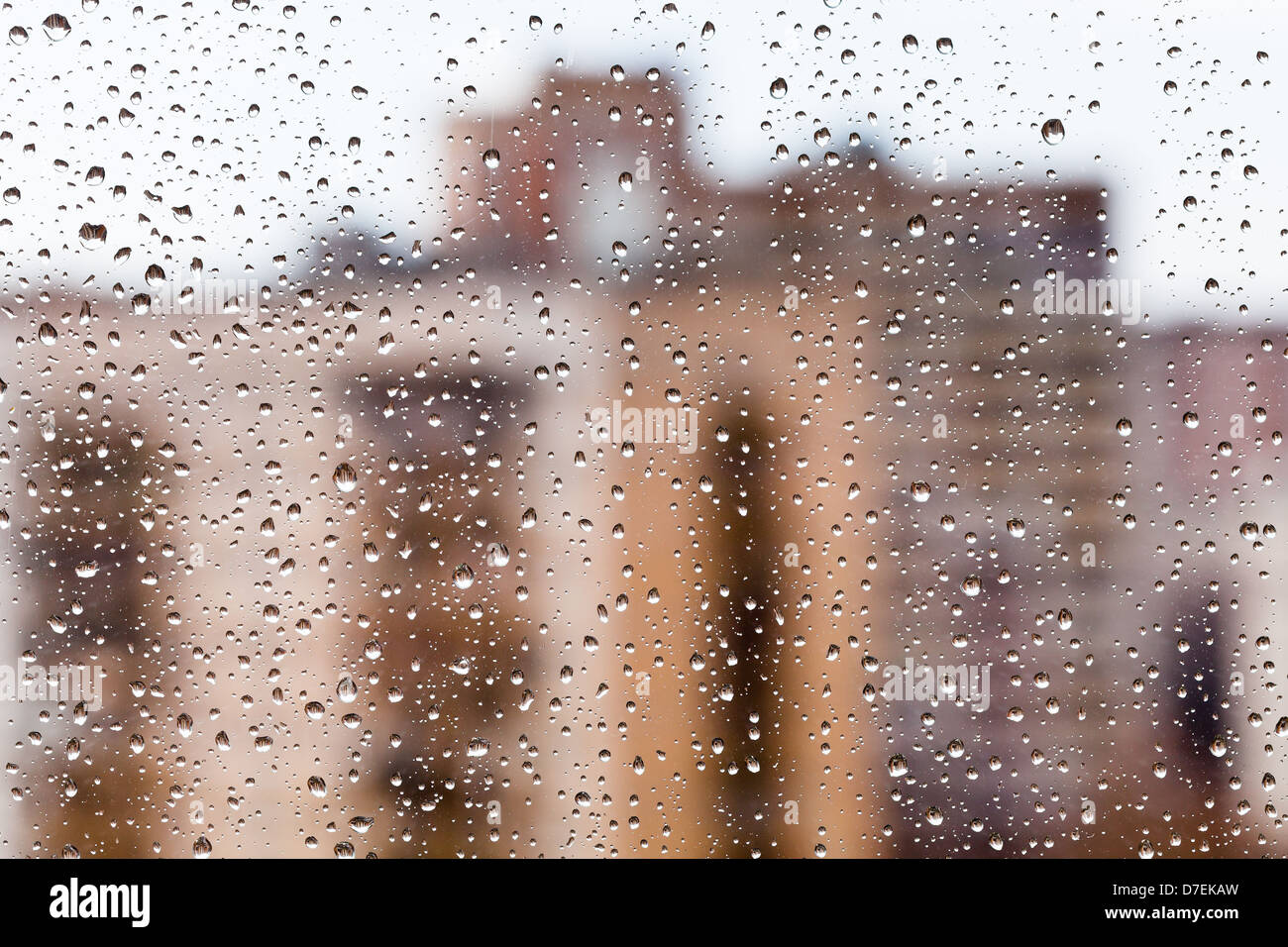 rain drops on glass with brick urban houses background Stock Photo - Alamy