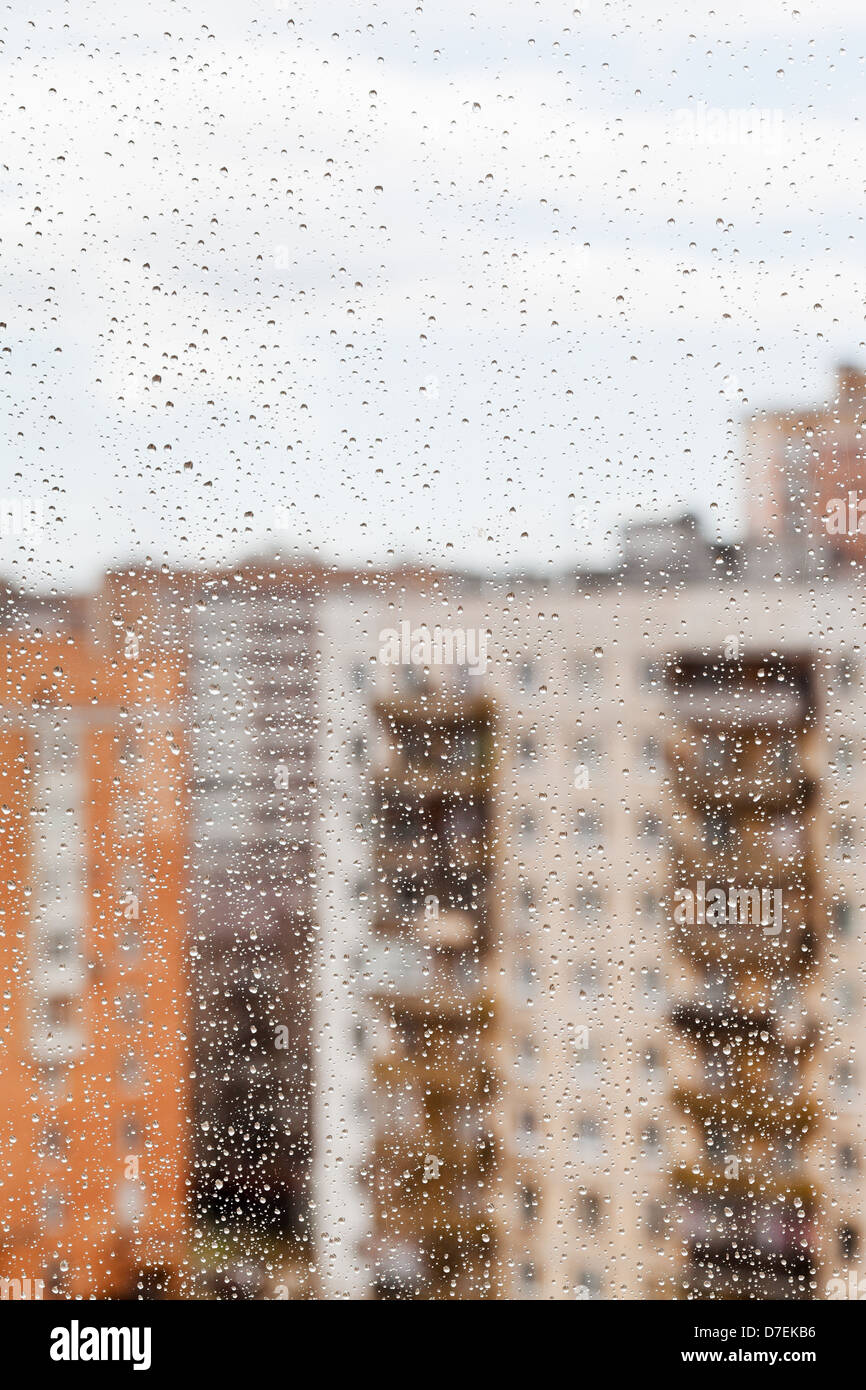 rain drops on glass window with town house background Stock Photo - Alamy