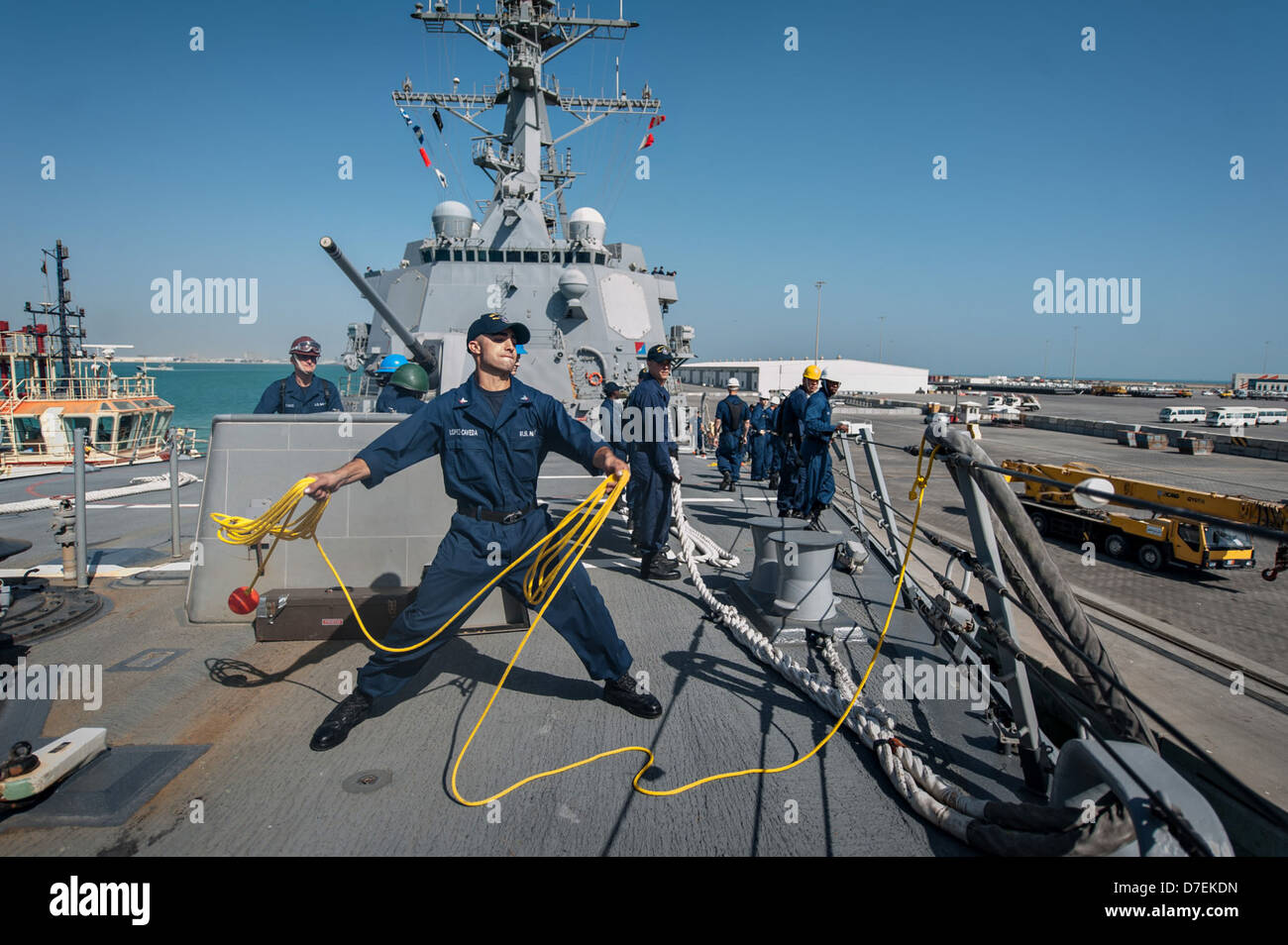 A Sailor throws a heaving line in Bahrain Stock Photo - Alamy