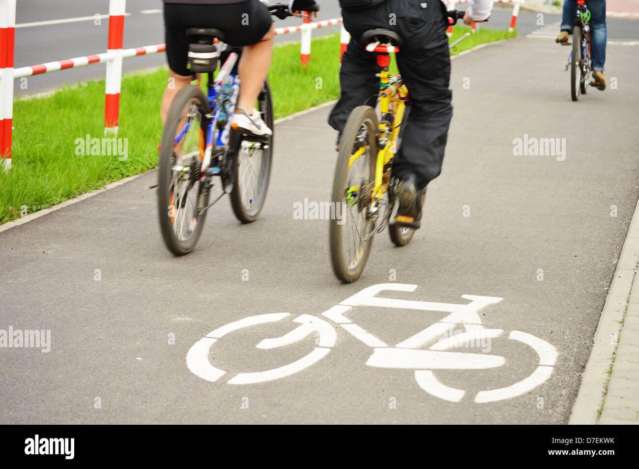 Bicycle road sign and bike rider Stock Photo - Alamy
