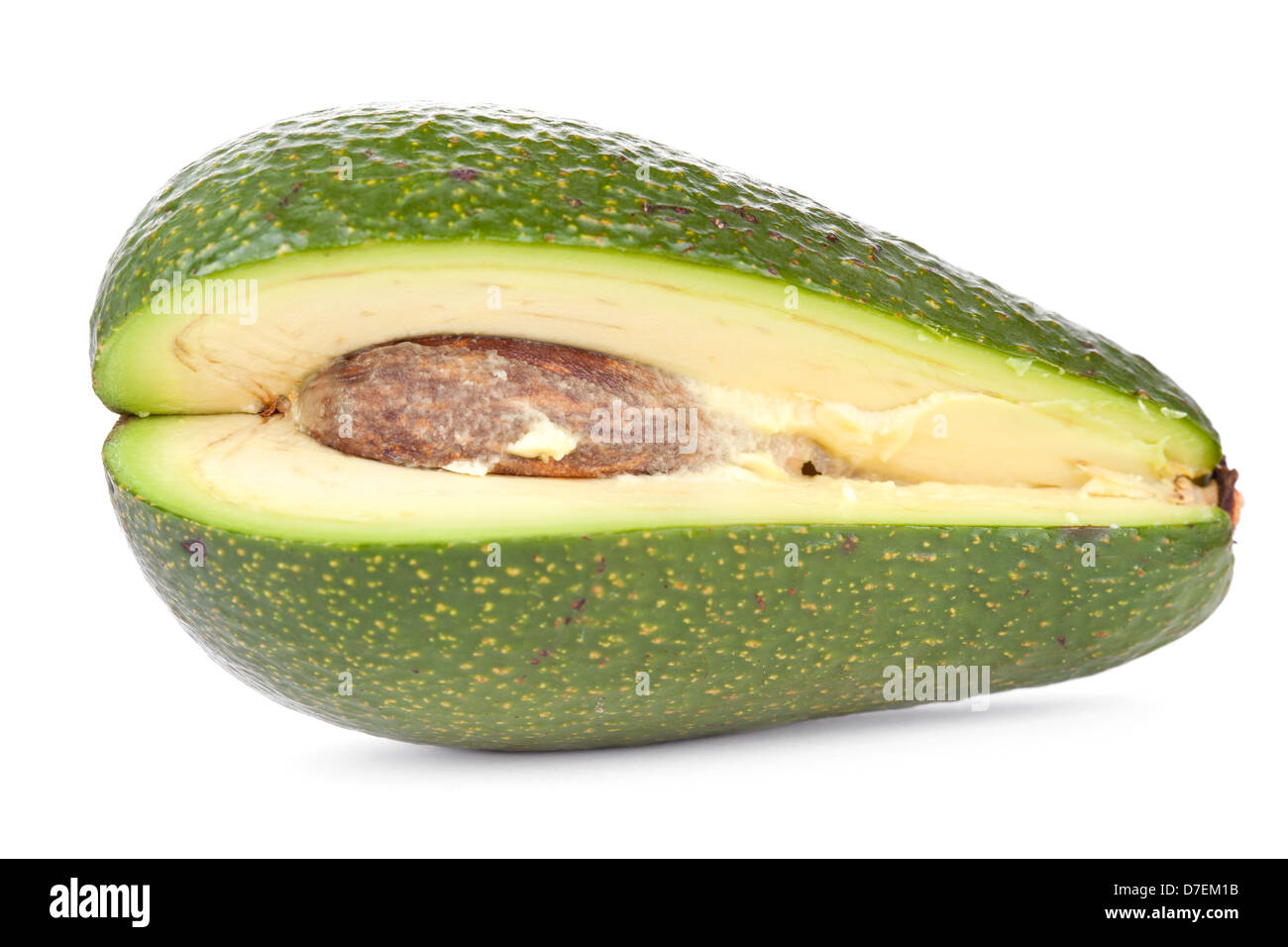 Whole avocado and slice closeup on white Stock Photo - Alamy