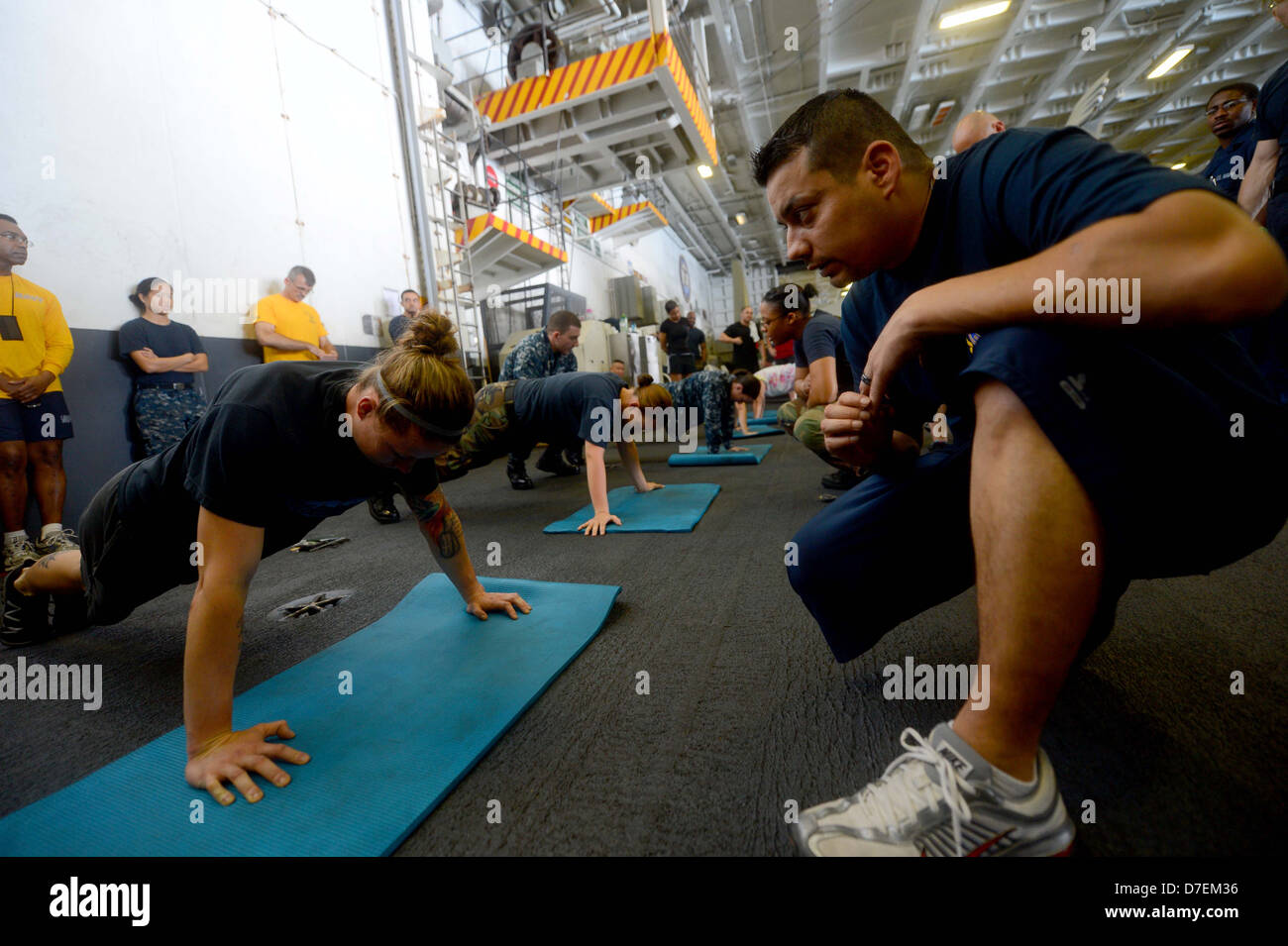 A Sailor competes in a push up competition at sea Stock Photo - Alamy