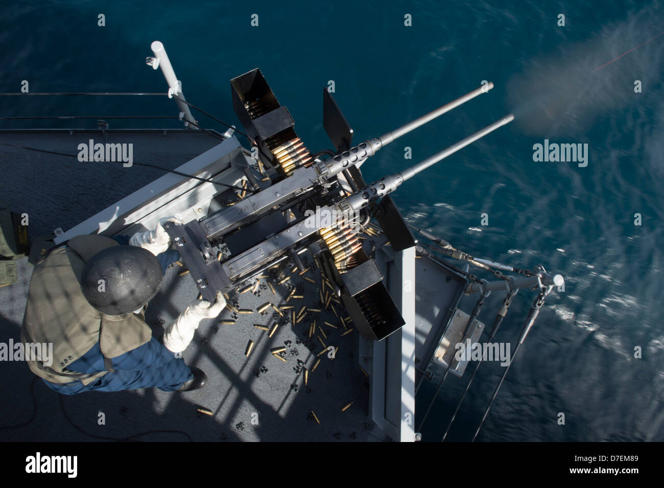 A Sailor fires twin machine guns aboard USS Boxer Stock Photo - Alamy