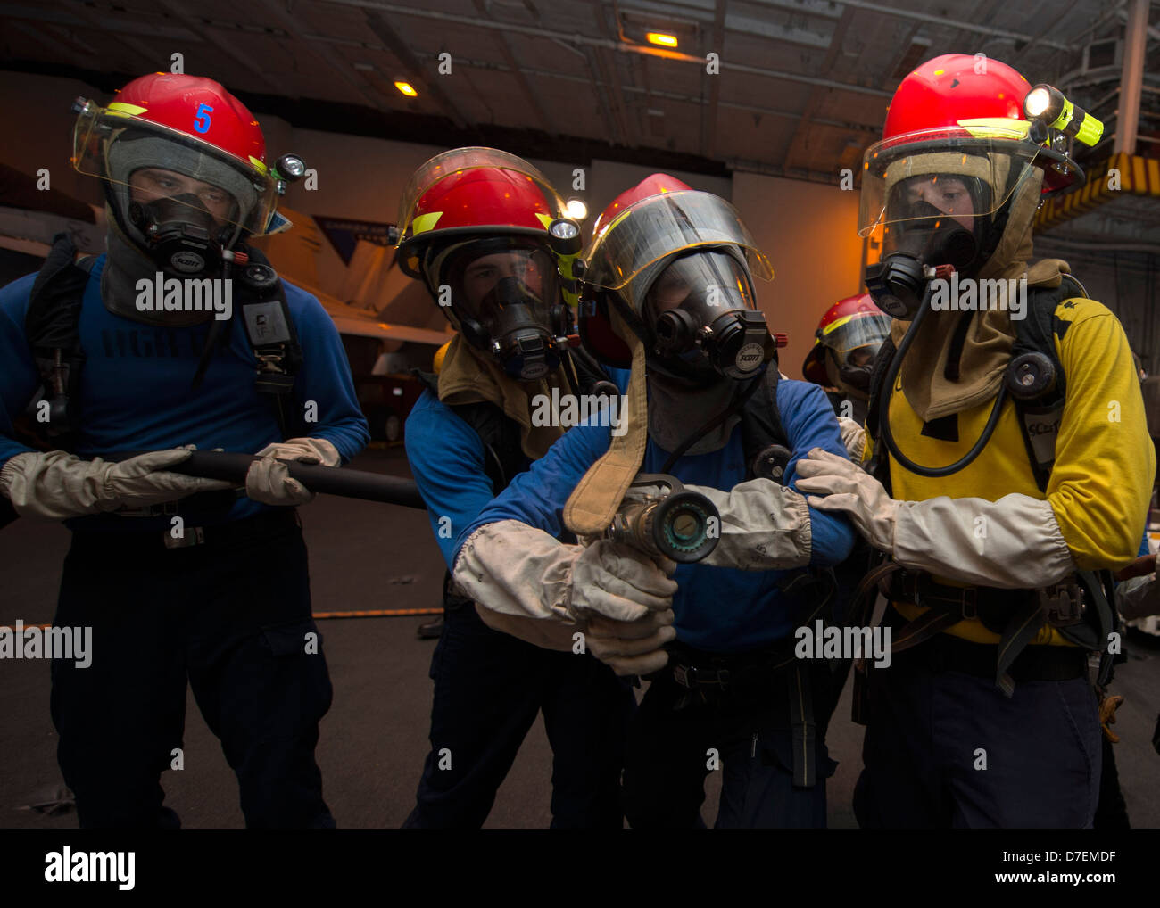 Sailors practice firefighting at sea Stock Photo - Alamy