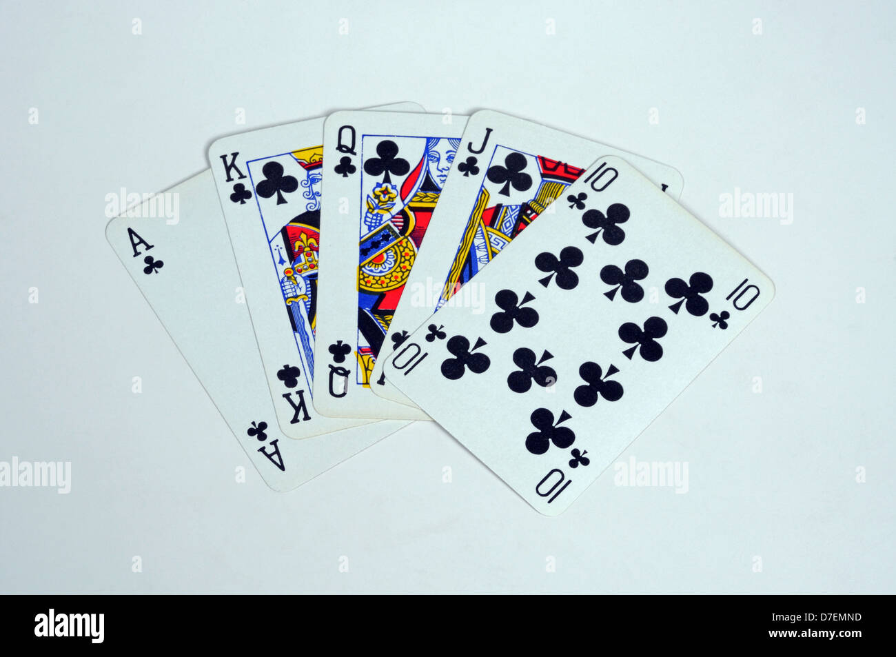 Royal flush poker hand in the club suit against a white background ...