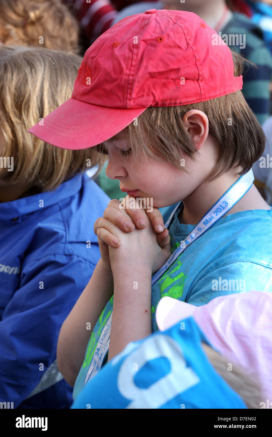 Boy praying at the childrens Last Supper at 34th German Evangelical ...