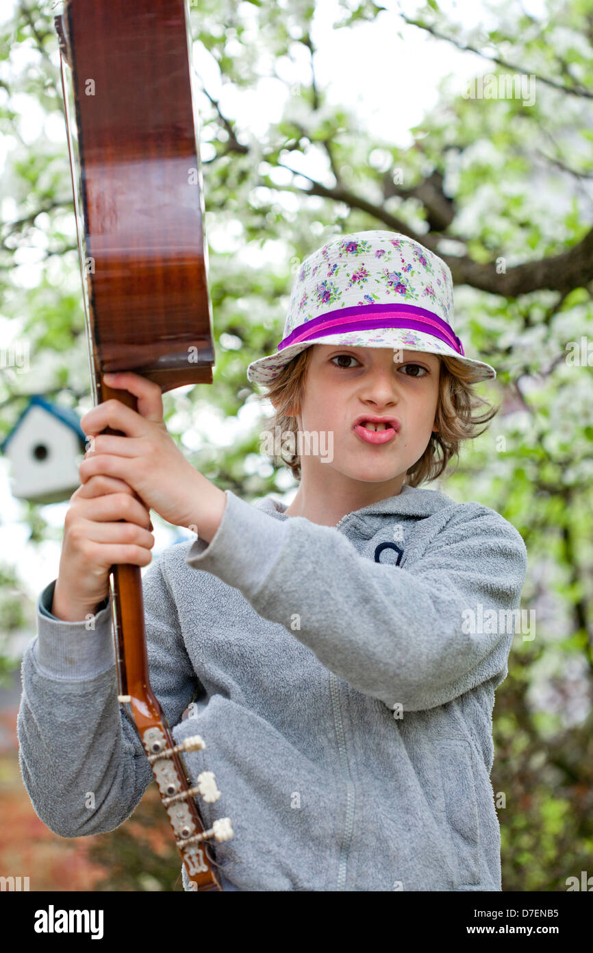 Blond hair boy playing guitar hi-res stock photography and images - Alamy