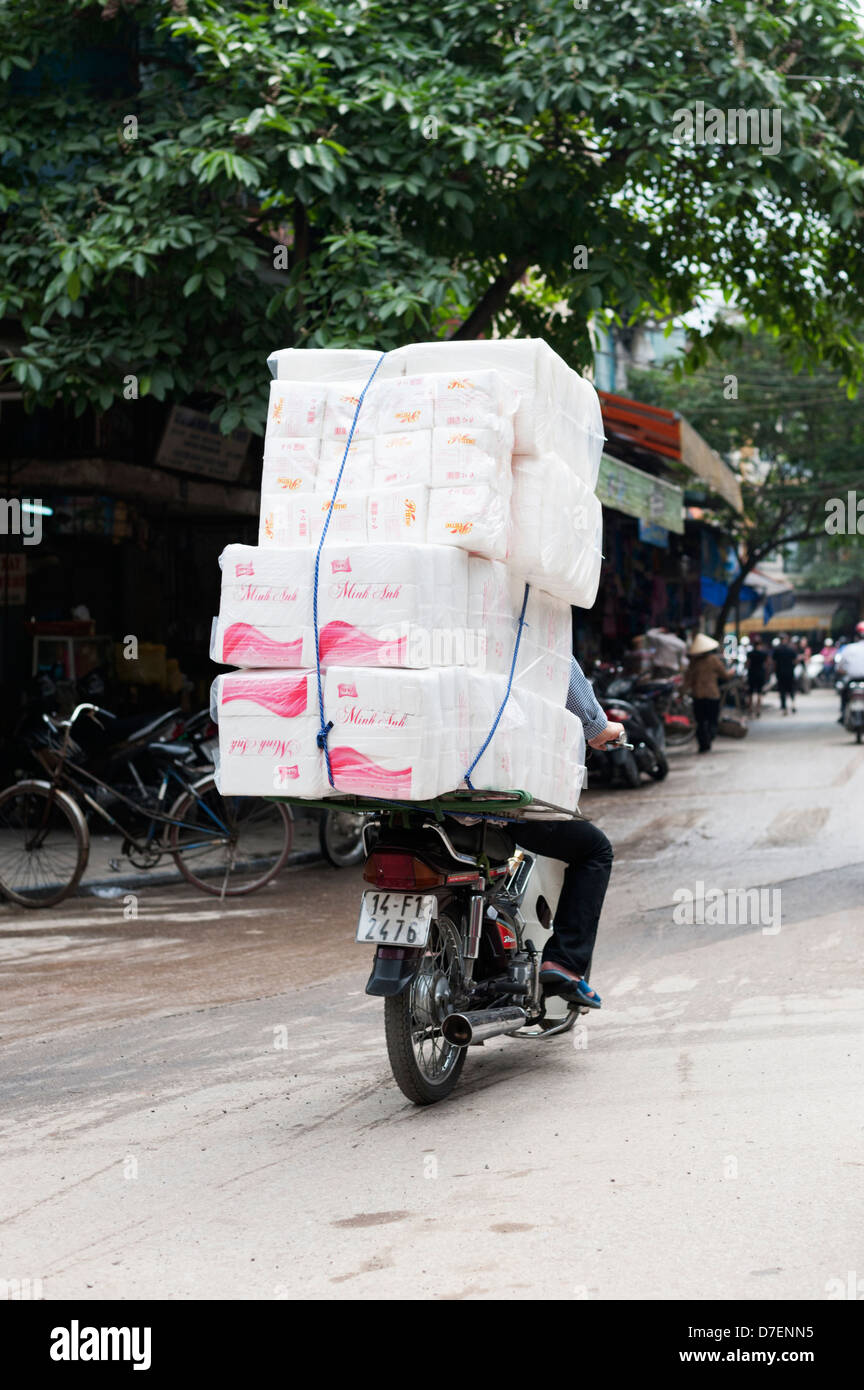 Hanoi, Vietnam - heavily loaded motor scooter in the historic Old ...
