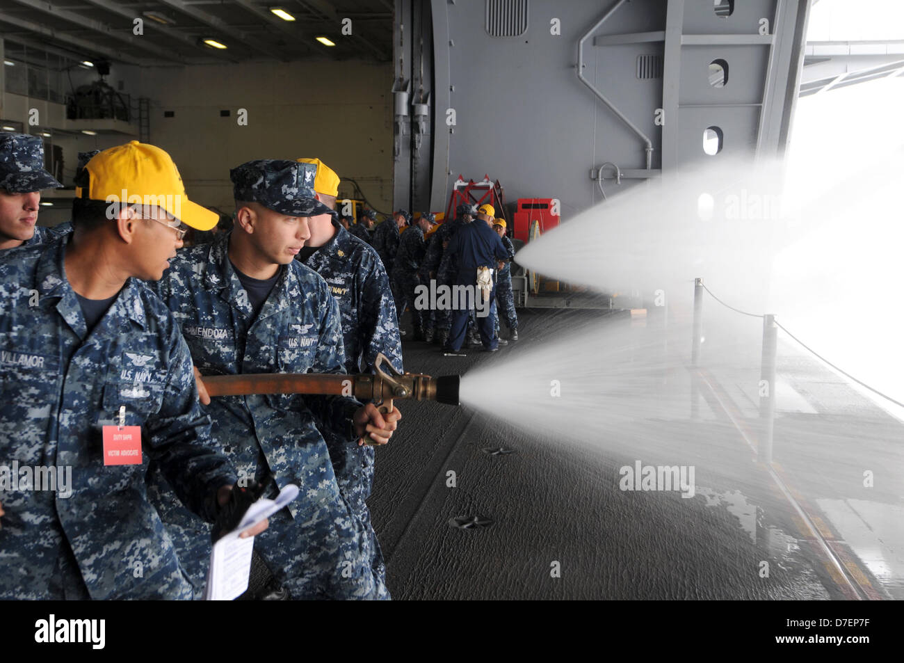 Sailors practice firefighting techniques Stock Photo - Alamy