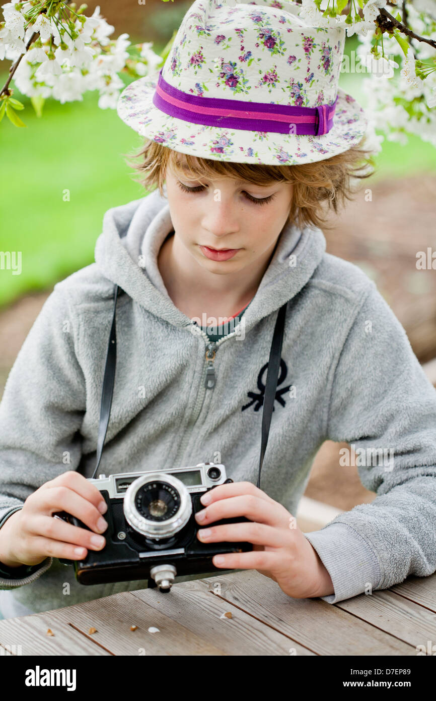 Portrait of a boy playing outdoor with an old camera Stock Photo - Alamy