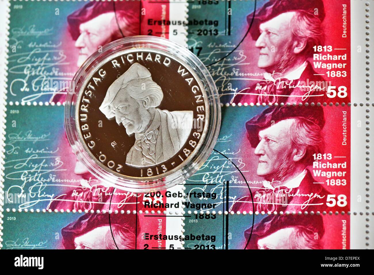 A commemorative Wagner coin lies on Wagner stamps during a presentation ...
