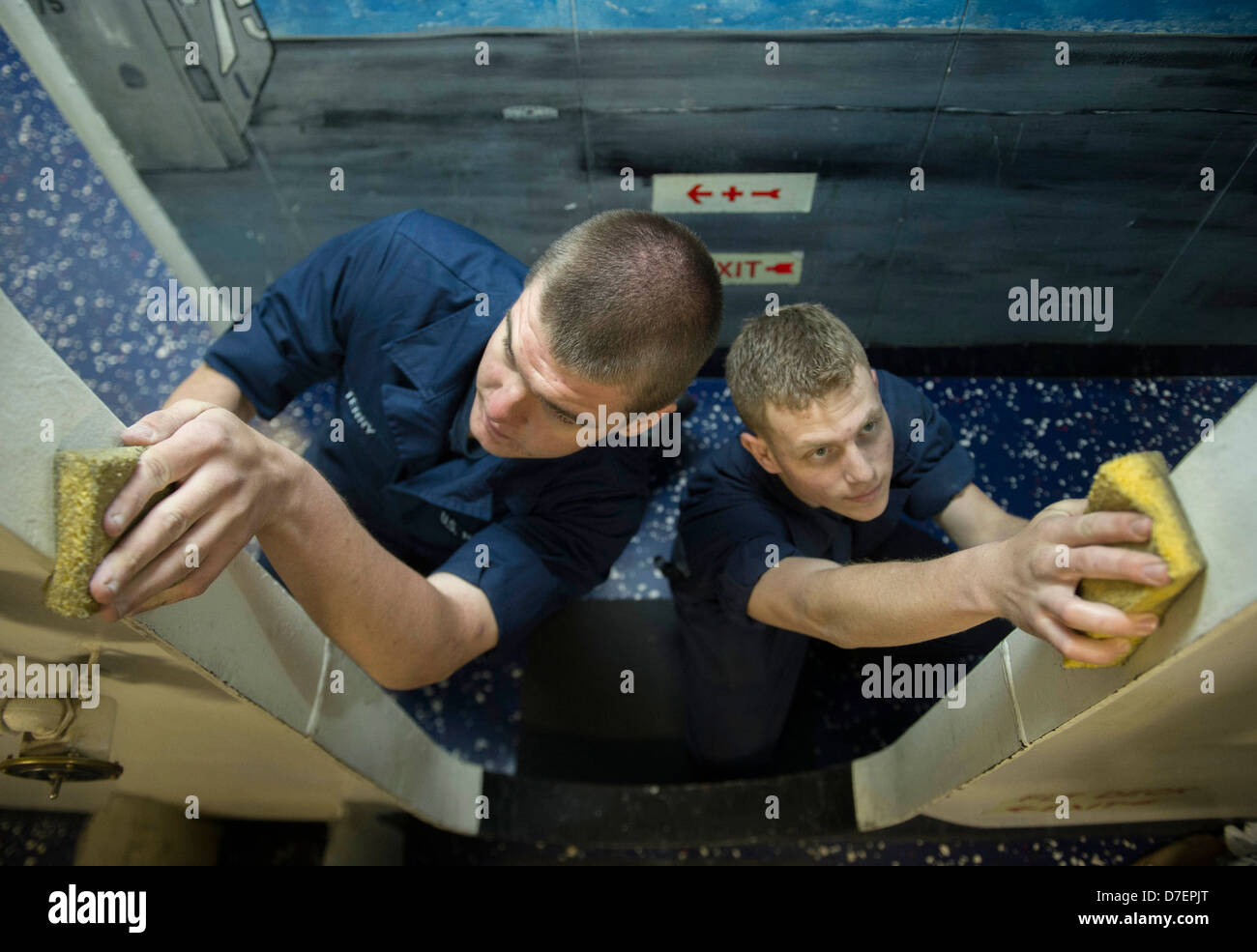 Sailors clean a passageway Stock Photo - Alamy