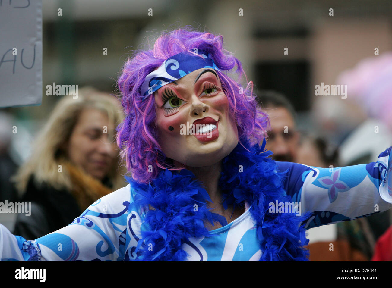 carnival goer wearing mask at a traditional French village fete in the ...