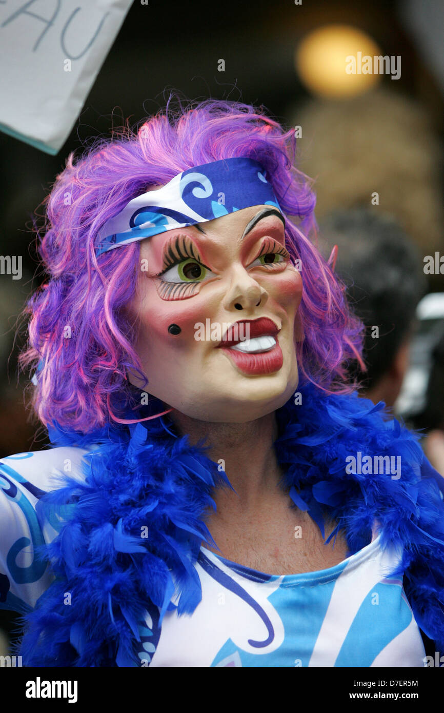 carnival goer wearing mask at a traditional French village fete in the ...
