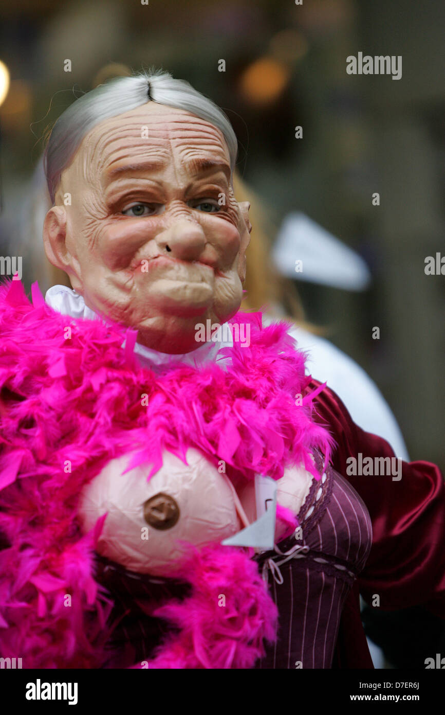 carnival goer wearing mask at a traditional French village fete in the ...