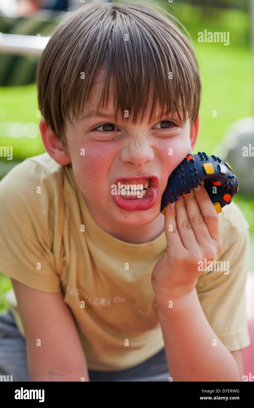 Portrait of a boy playing outdoor Stock Photo - Alamy
