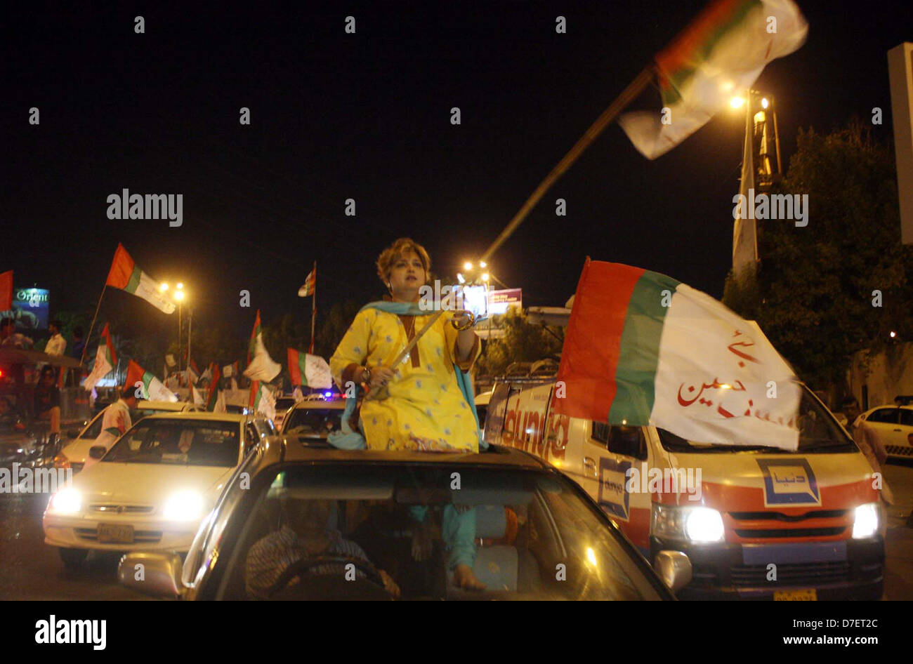 Activists of Muttahida Qaumi Movement (MQM) pass through a road during ...