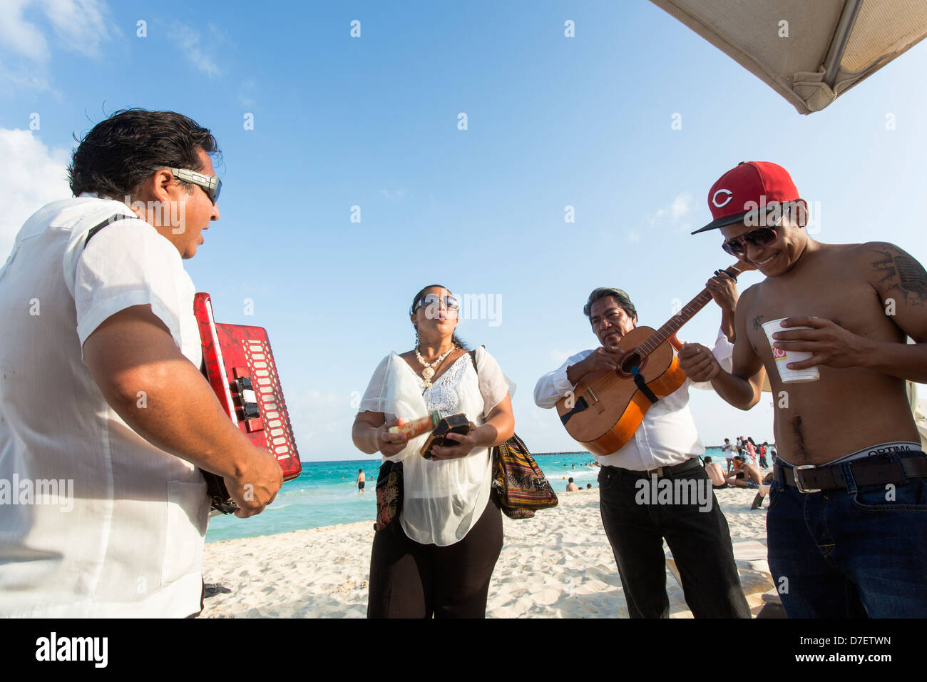 group of musicians playing traditional Mexican music on the beach Stock ...