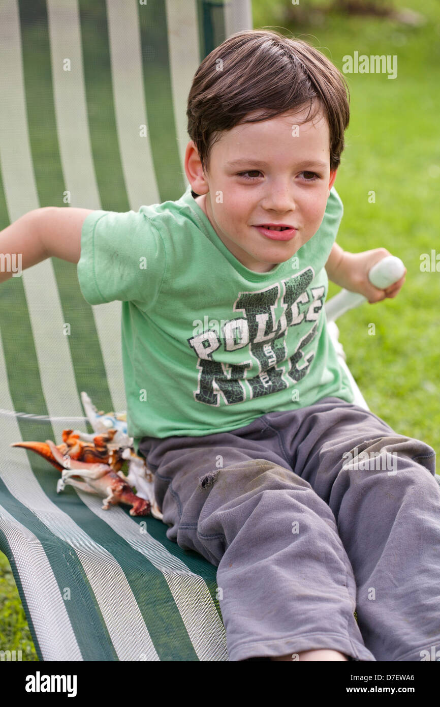Child playing alone outside hi-res stock photography and images - Alamy