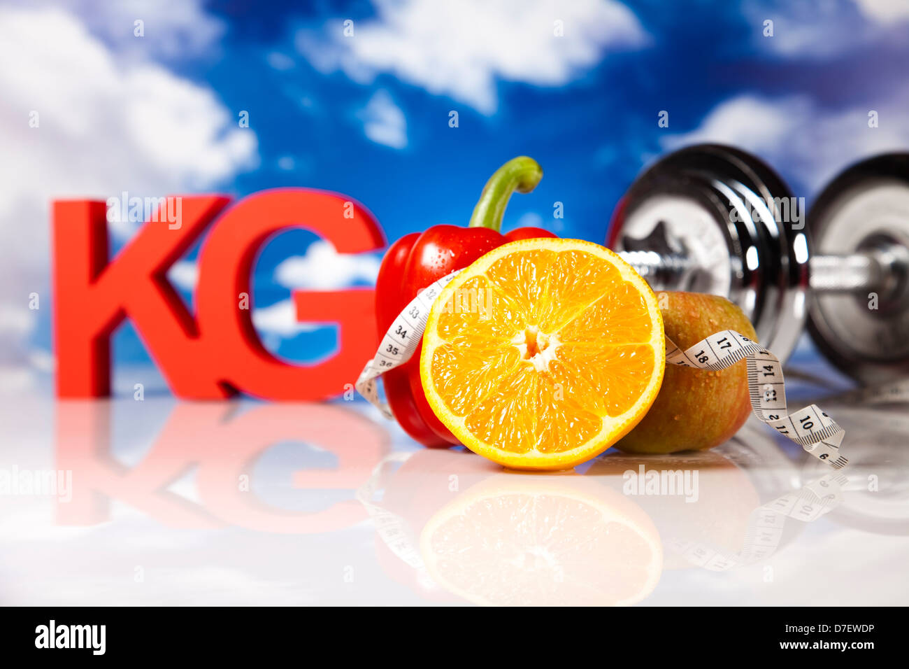 Measuring of dumbbell, fruits and vegetables Stock Photo - Alamy