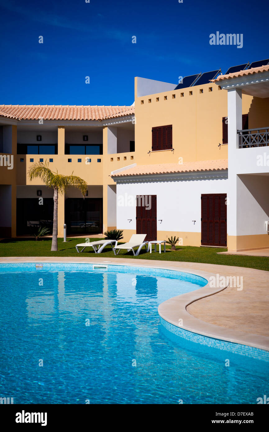 Apartment house with swimming pool. Vertical shot Stock Photo - Alamy