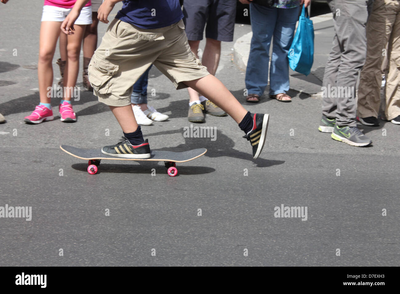 person riding skateboard in street road in city town Stock Photo - Alamy