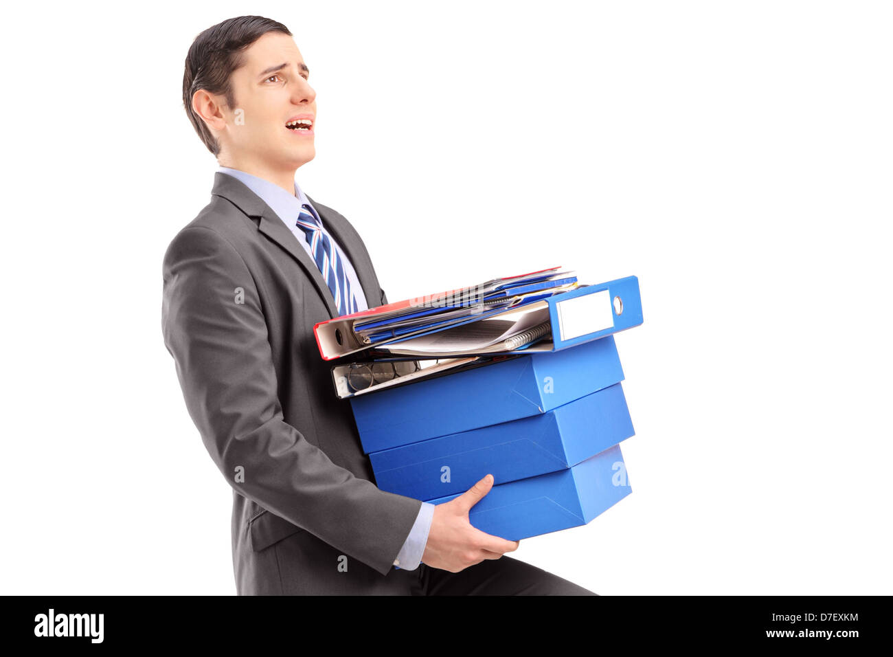 A professional man carrying heavy folders, isolated on white background ...