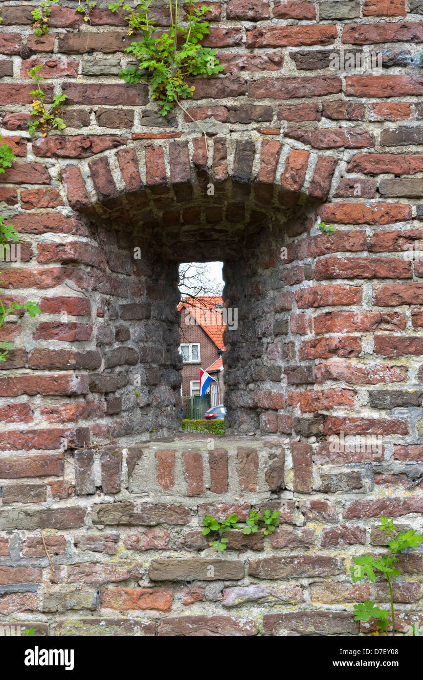 Embrasure in the ancient city defense wall of Amersfoort with the Dutch ...
