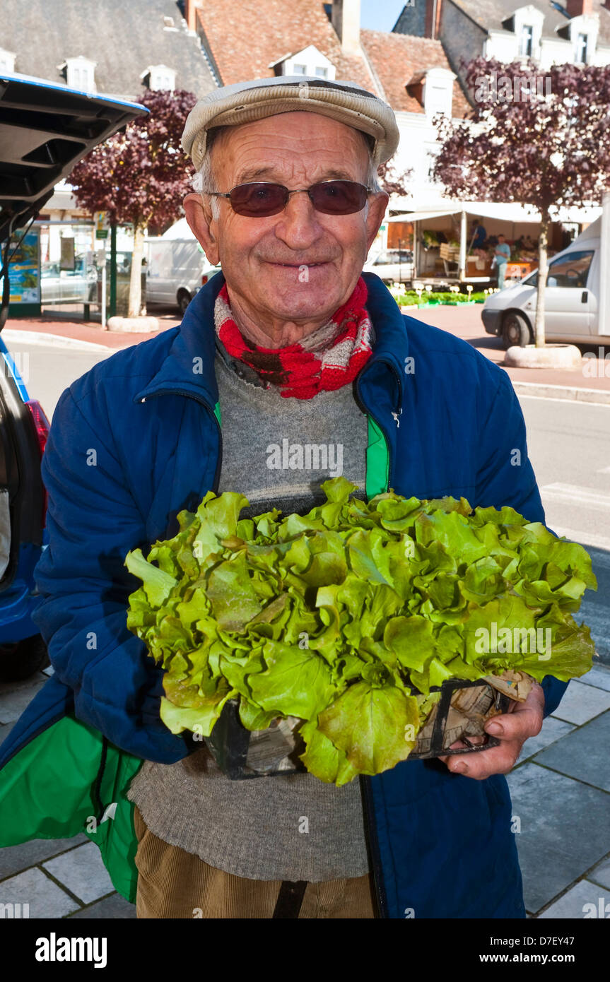 French man selling fresh vegetables on pavement - France Stock Photo ...