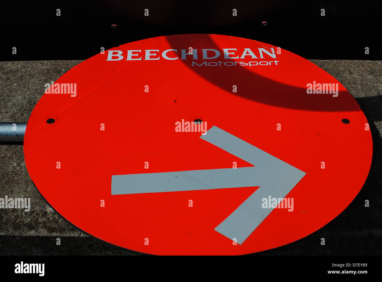 Beechdean Motorsport arrow sign orange Stock Photo - Alamy