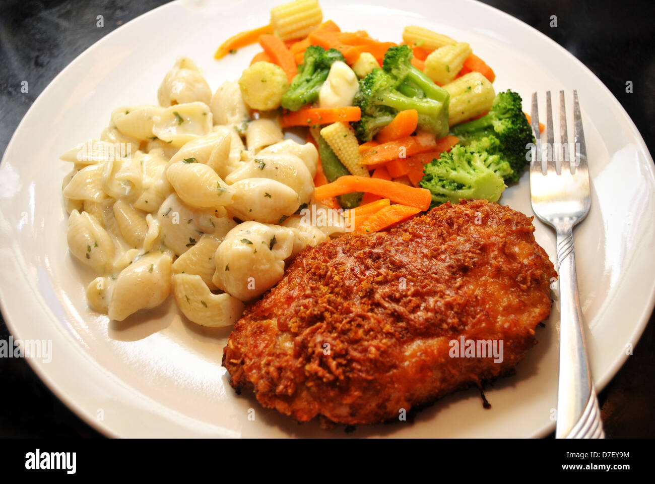 Eating a Delicious Pork Chop Dinner Stock Photo - Alamy