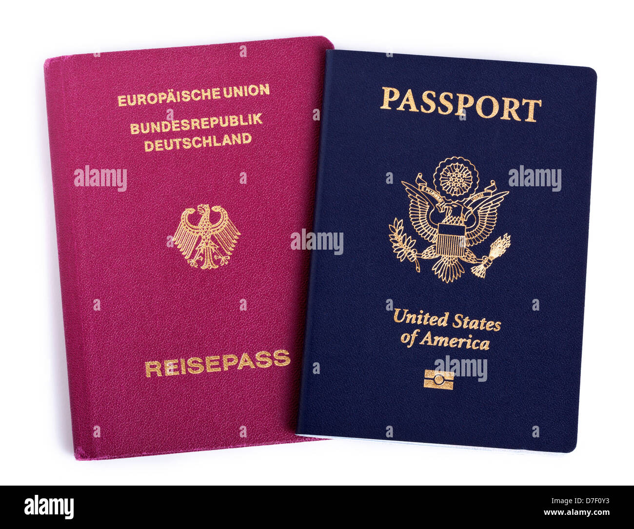 USA German passports isolated on white background. Both passports are ...