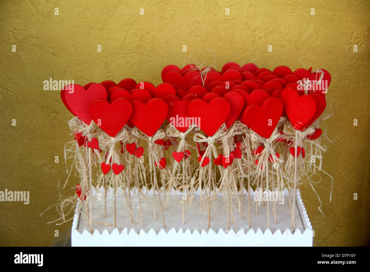 love hearts on a stick in shop window Stock Photo - Alamy