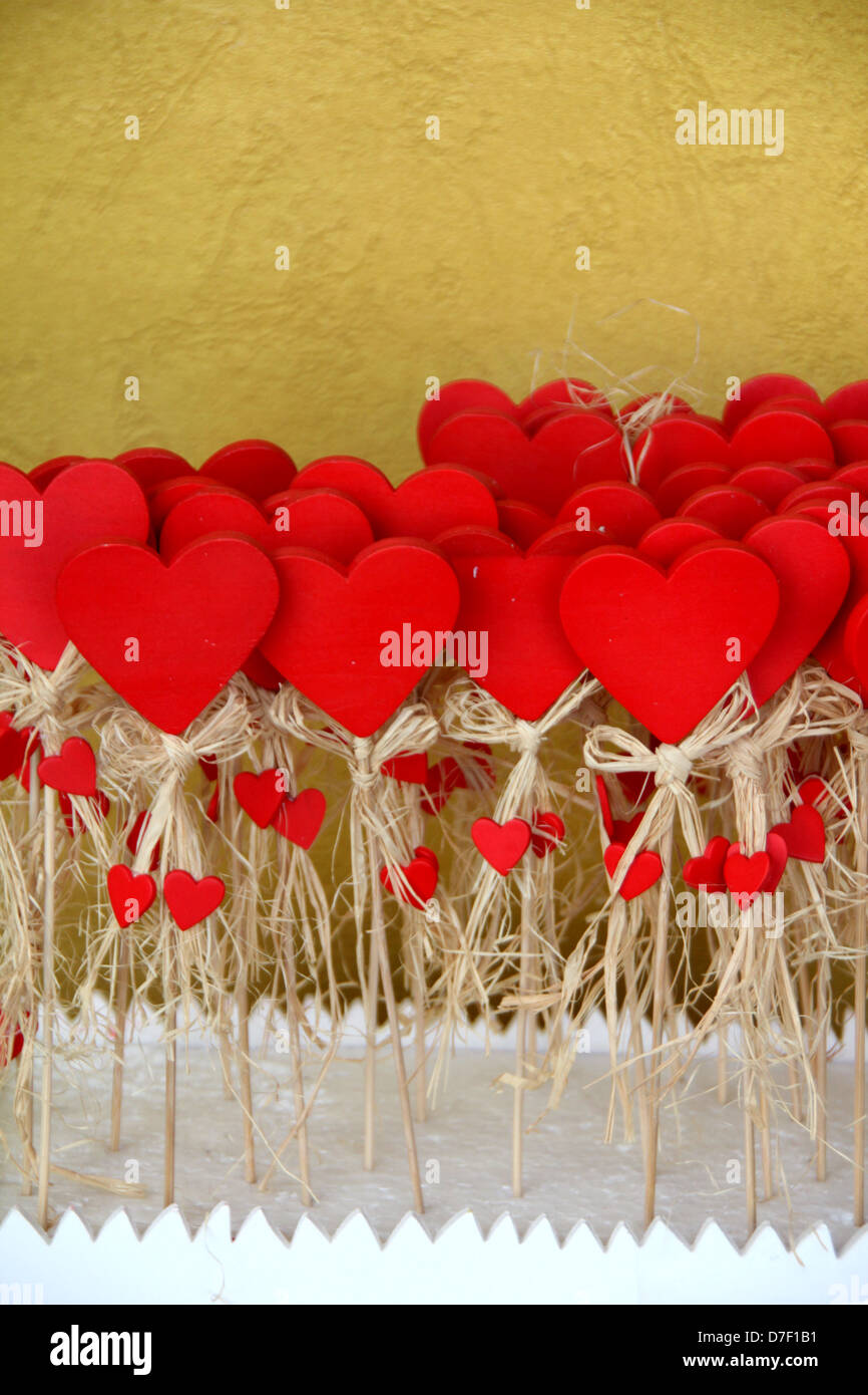 love hearts on a stick in shop window Stock Photo - Alamy