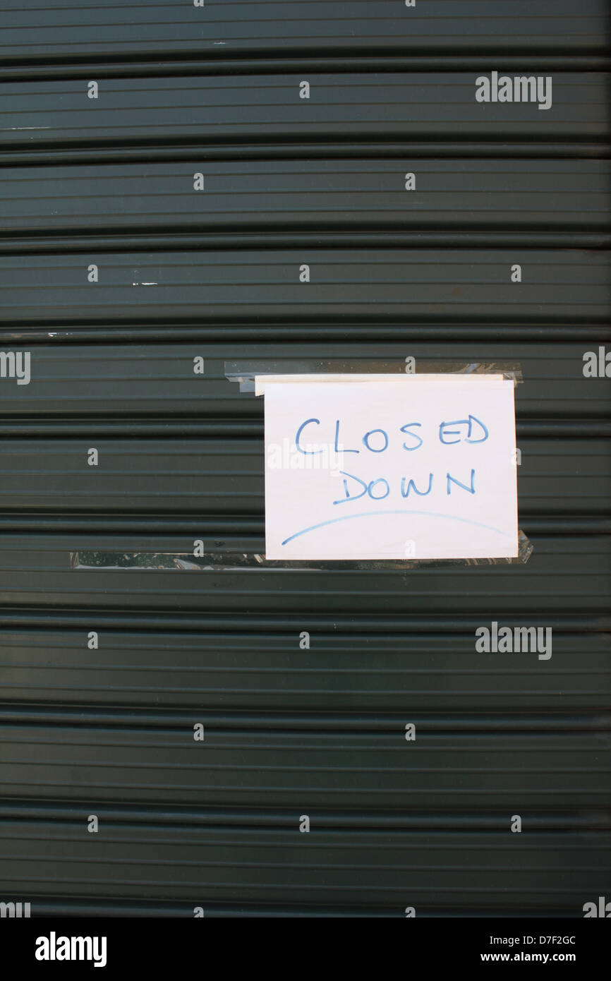 closed down message on shop shutters Stock Photo - Alamy