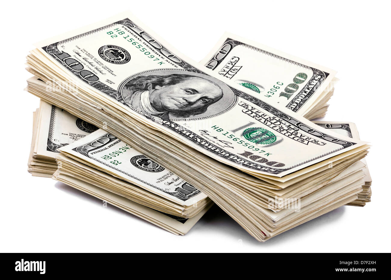 Three stacks of 100 US$ money notes on top of eachother, isolated on ...