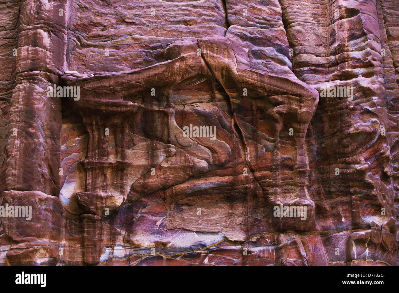 A rugged rock wall of colourful sandstone;Petra jordan Stock Photo - Alamy