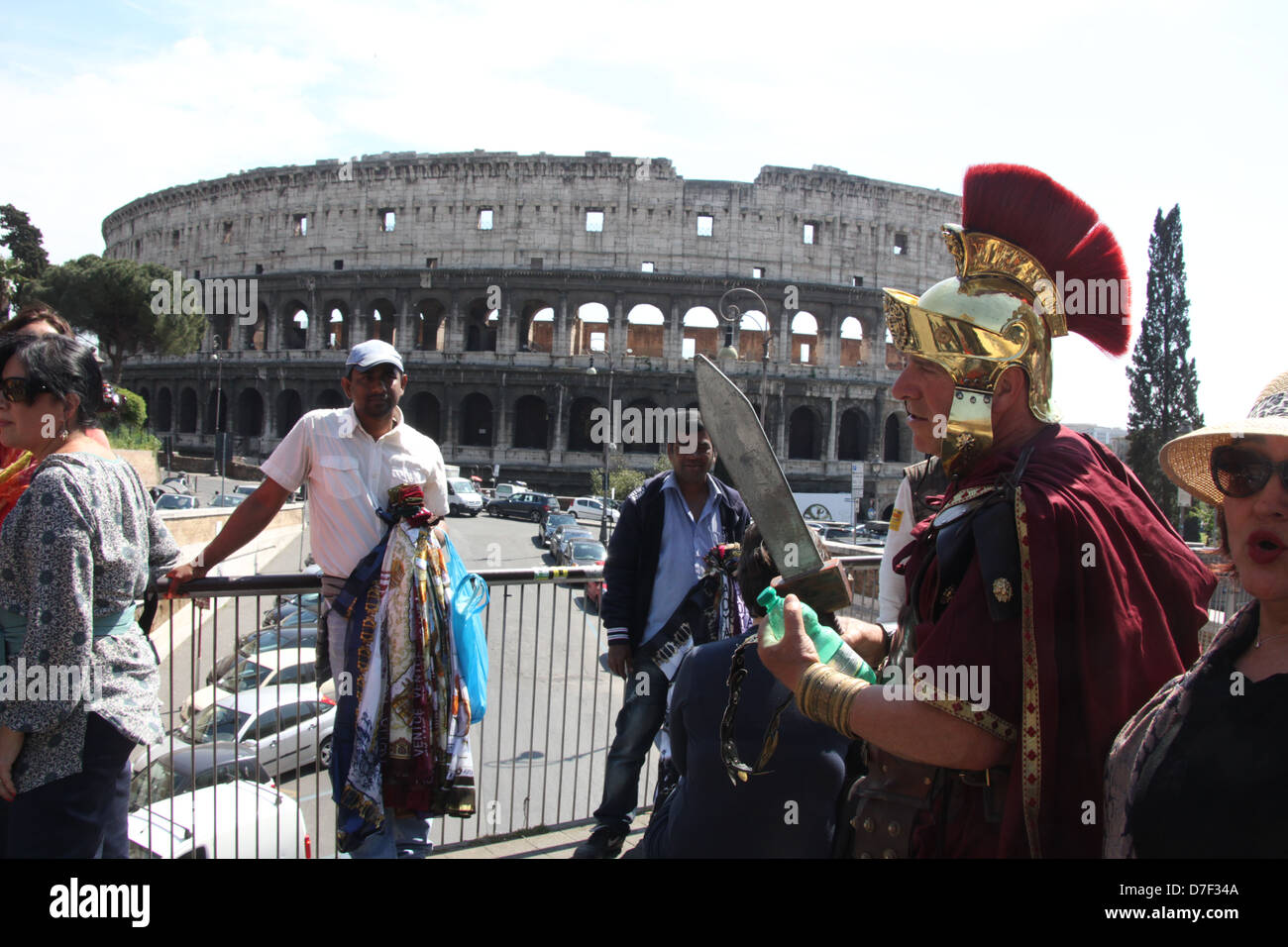 scene by the colosseum in rome italy Stock Photo - Alamy
