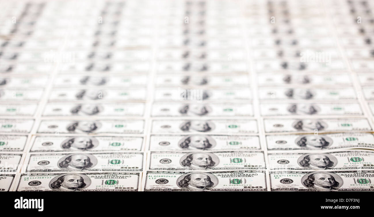 A high angle view of a very large amount of 100 US$ money notes, with a ...