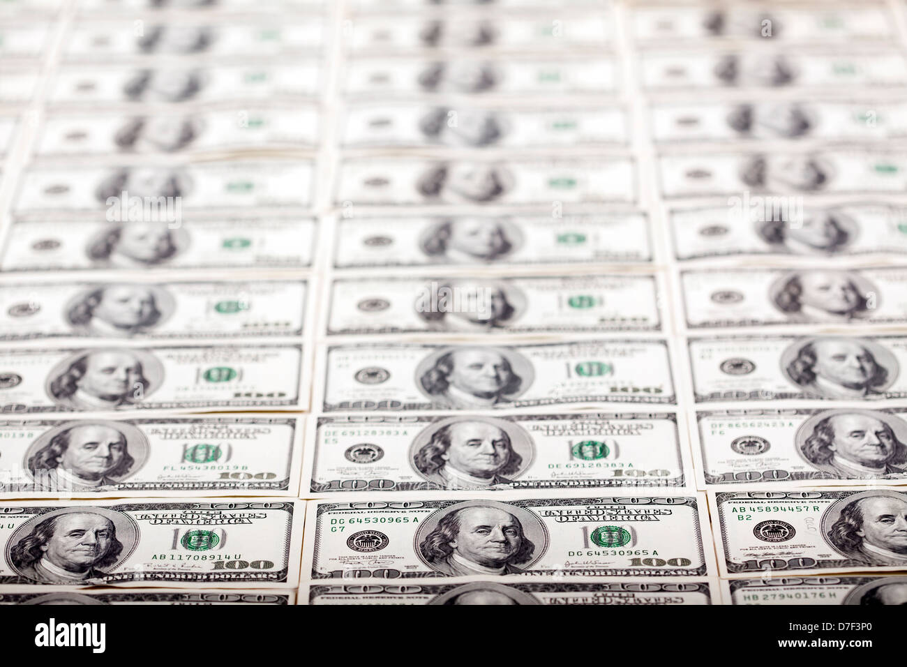 A high angle view of a very large amount of 100 US$ money notes, with a ...