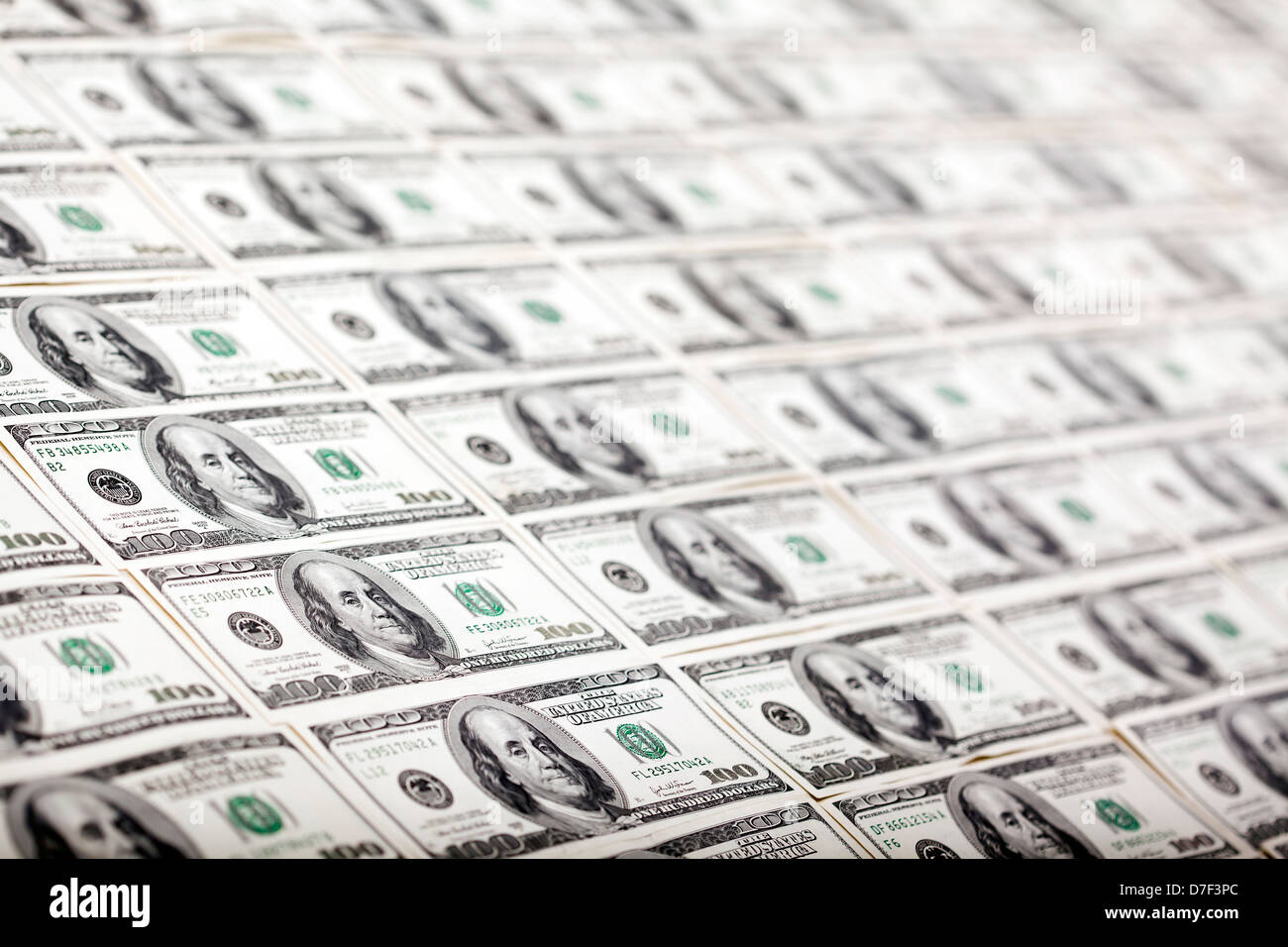 A large quantity of 100 US$ money notes lined up in a vertical row ...