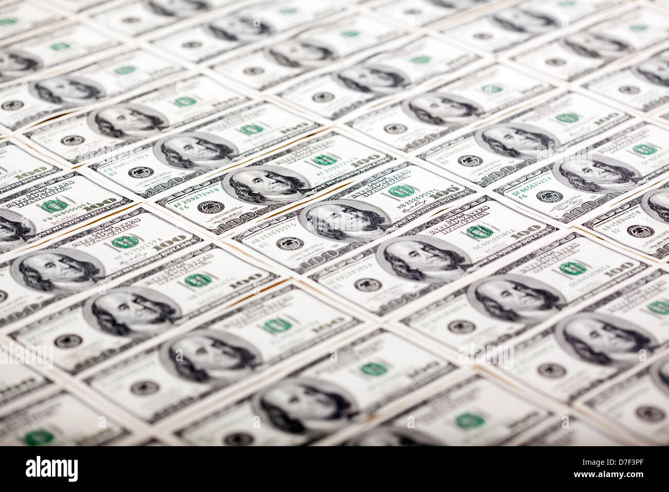 A large quantity of 100 US$ money notes lined up in a vertical row ...