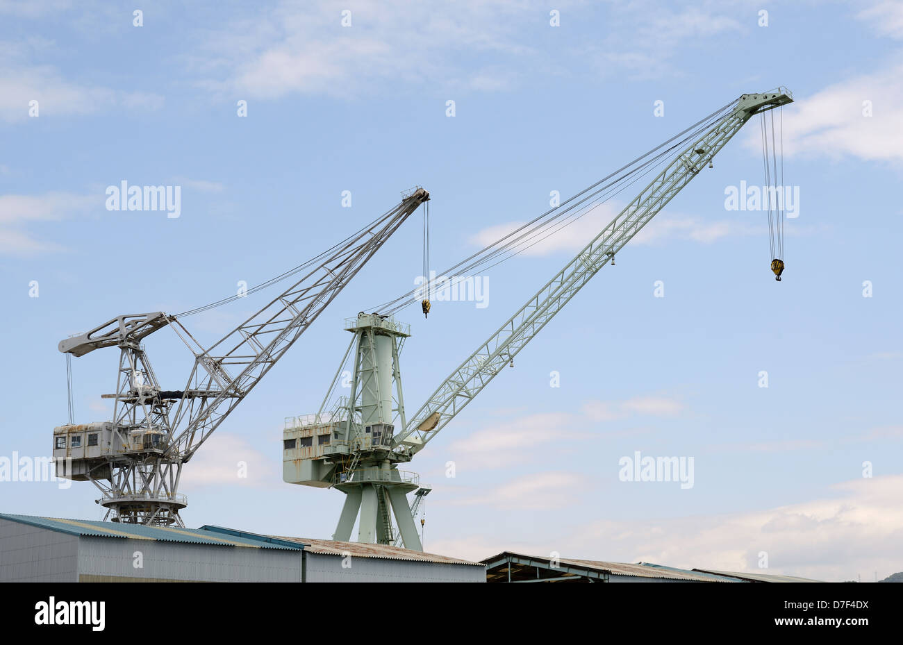 Building crane boom with steel hook Stock Photo - Alamy