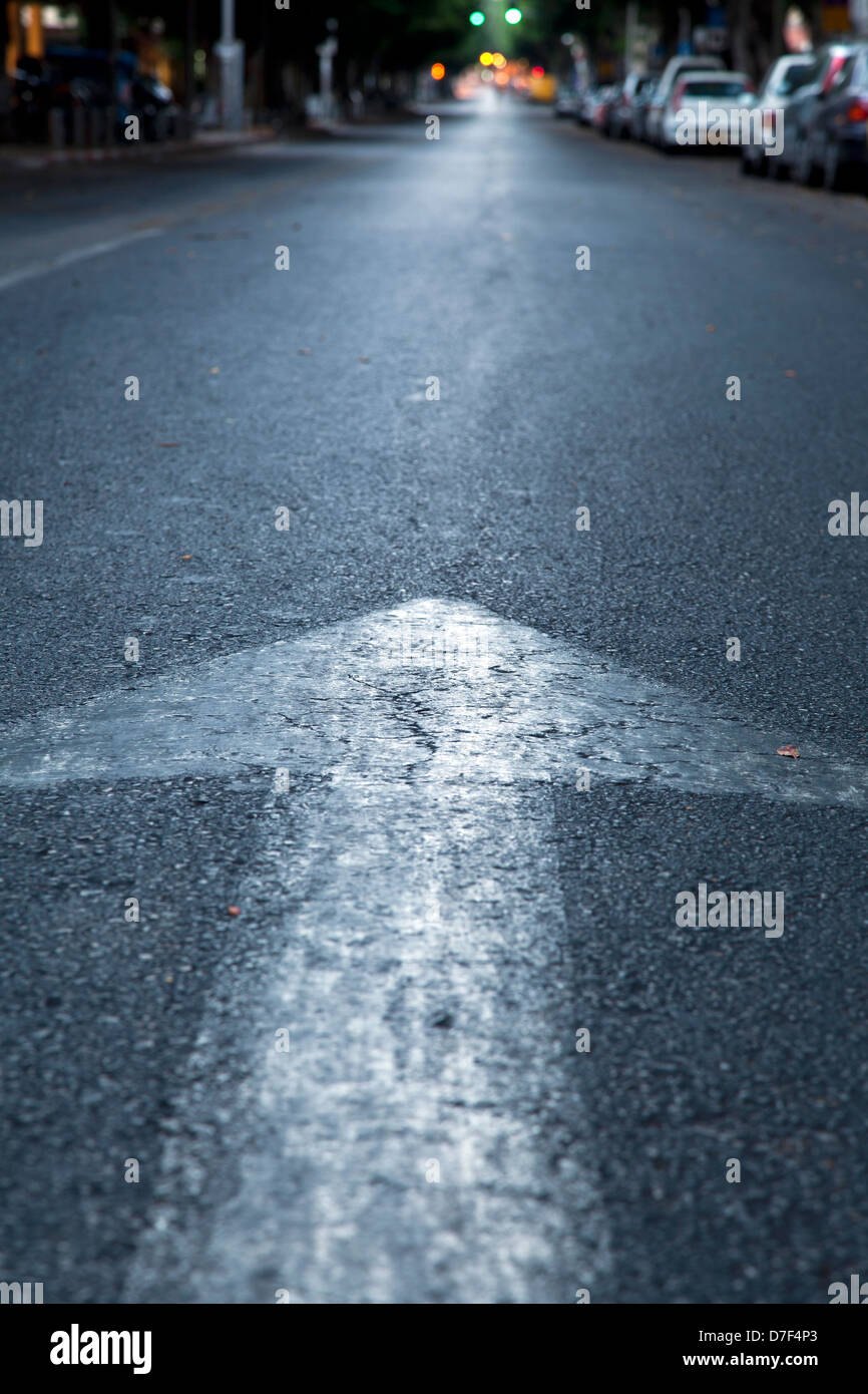 Directional arrow pointing forward on an empty street in Tel-Aviv ...