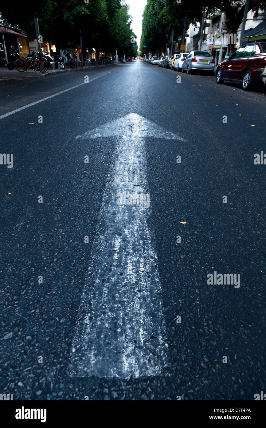 Directional arrow pointing forward on an empty street in Tel-Aviv ...